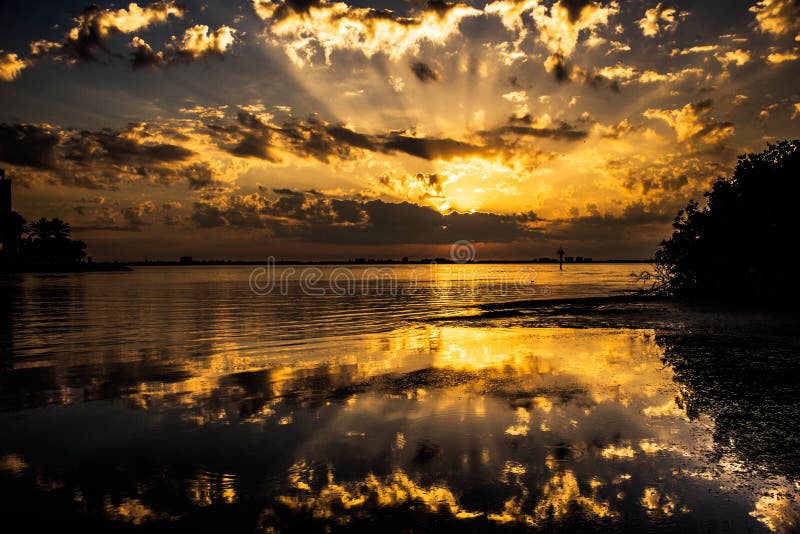 Striking Sunlight Sunset Beautiful on the Beach Water Reflection Stock ...