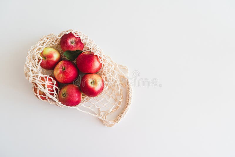 String Bag with Red Ripe Apples on White Background. Top View Stock ...