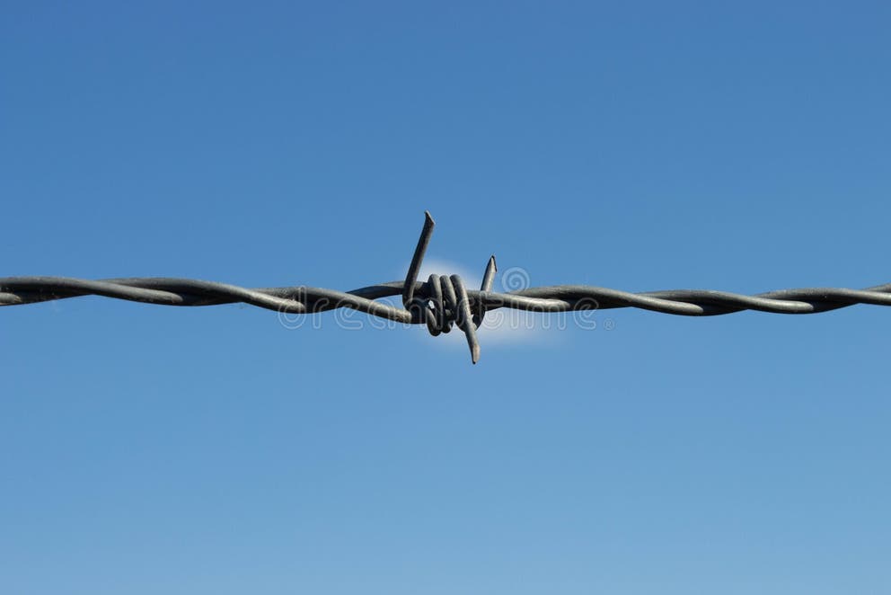 A String of Barbed Wire with a Cloud Behind Stock Photo - Image of ...
