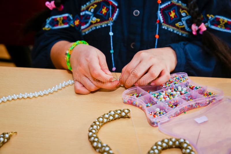 The Child Puts the Beads in His Hand Stock Image - Image of beads, puts ...