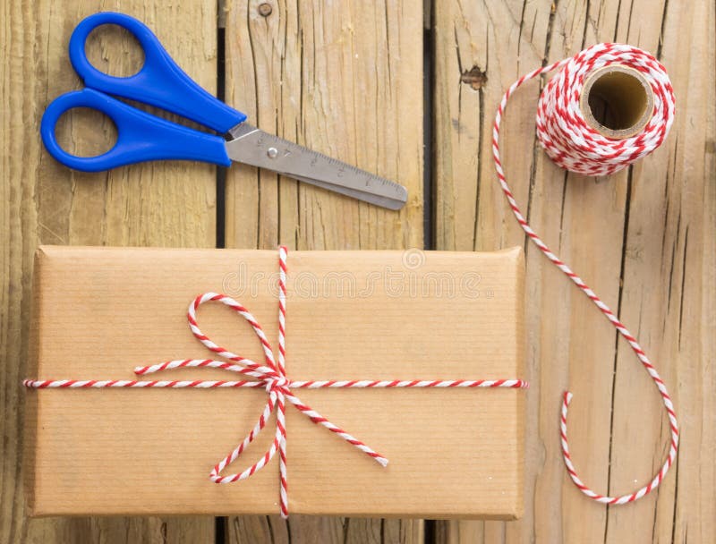 String and Brown Paper Parcel with Scissors and String Stock Photo ...