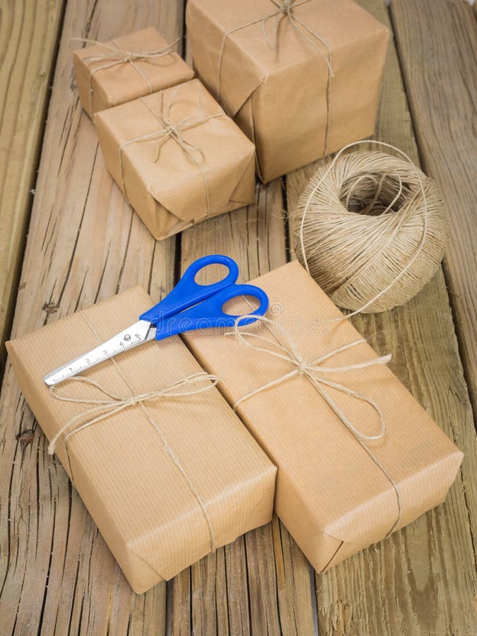 String and Brown Paper Parcels with Scissors and String Stock Image ...
