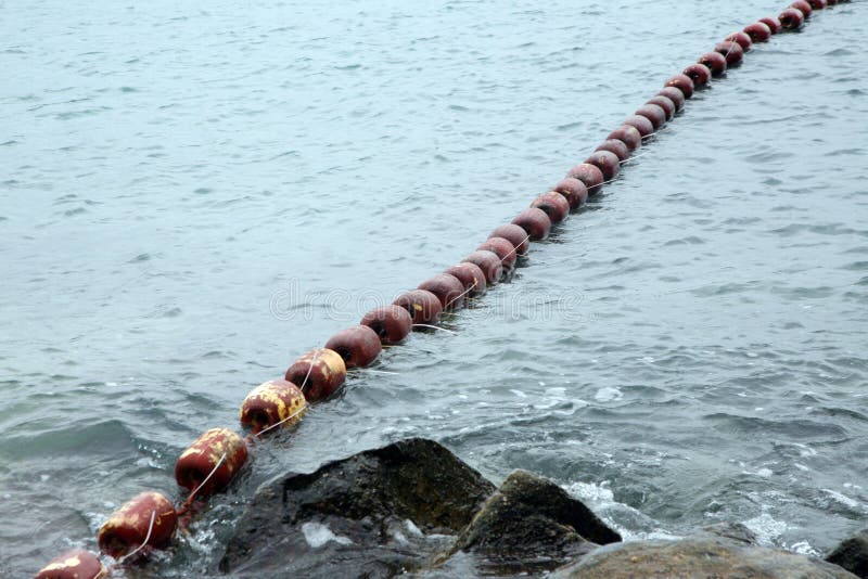 String of Buoys Floating on Ocean Surface Stock Image - Image of coast ...