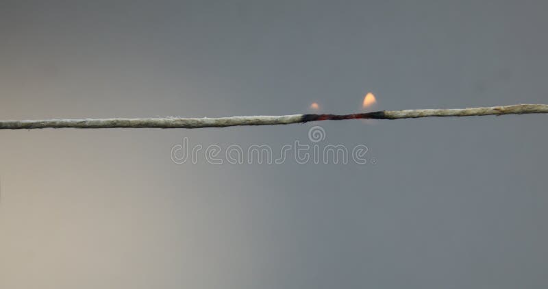 String burns with flame stock footage. Video of burn - 213634122