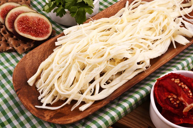 String Cheese on Chopping Board Stock Image - Image of branch ...