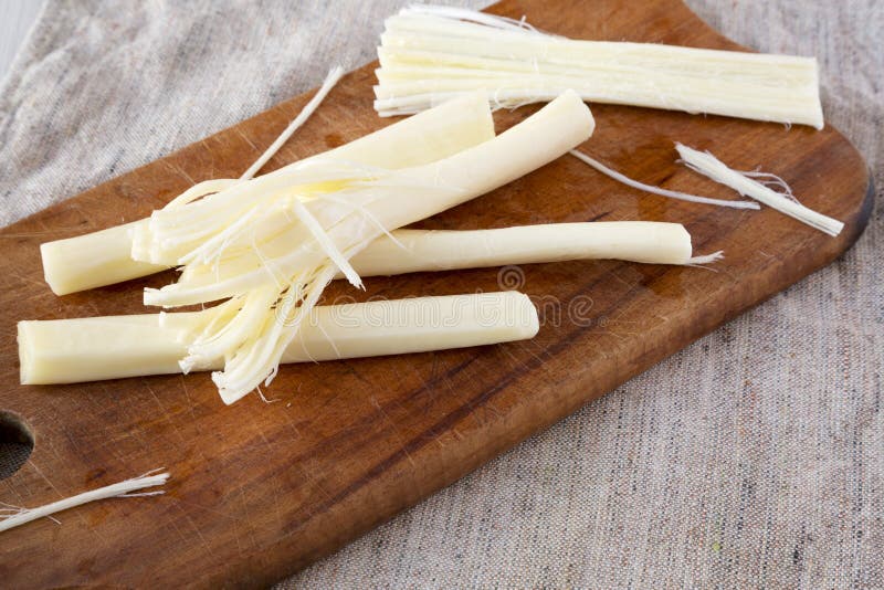 String Cheese on Rustic Wooden Board, Low Angle View. Healthy Snack ...
