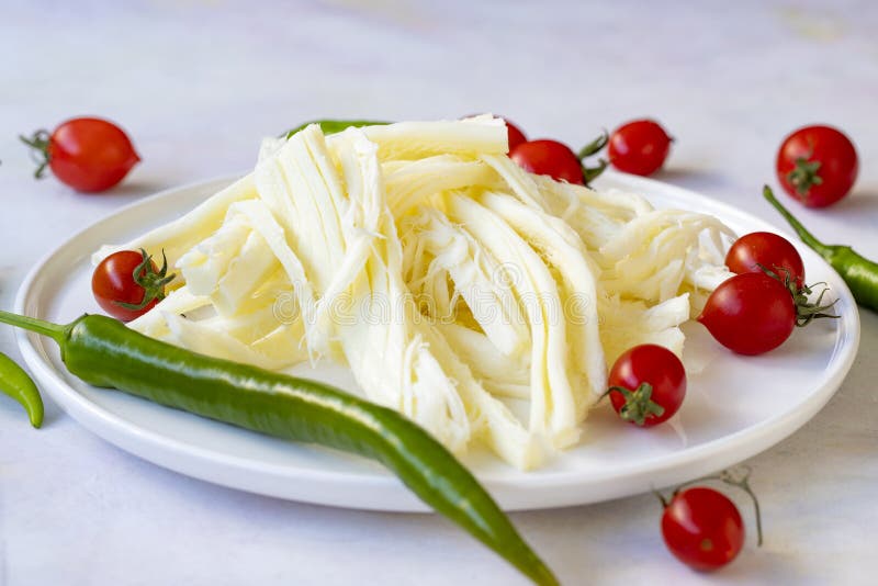 String Cheese on a White Plate. Close Up Stock Photo - Image of cheeses ...