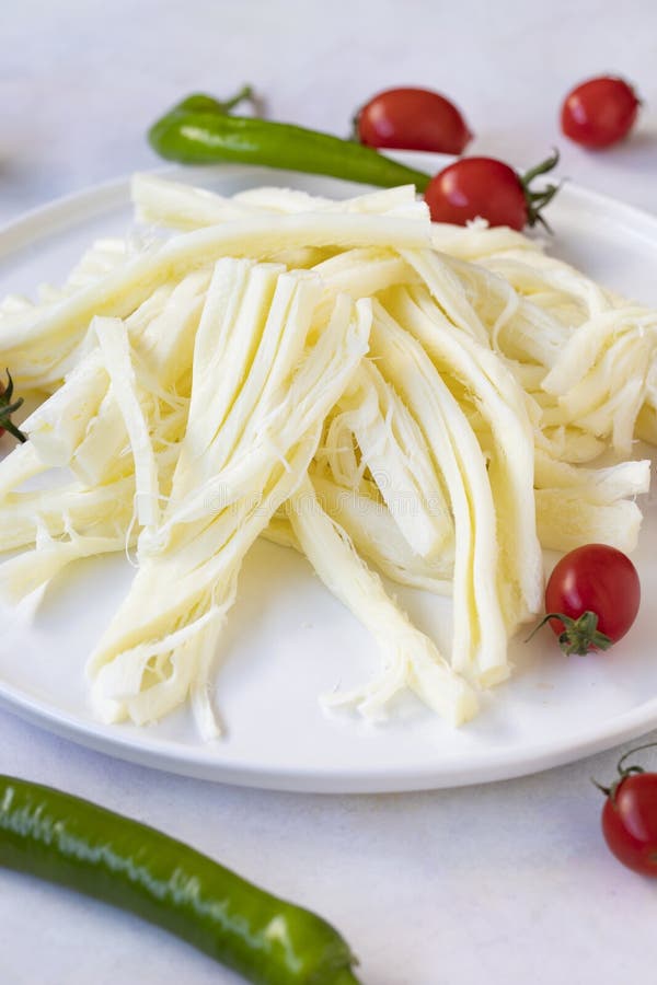 String Cheese on a White Plate. Close Up Stock Photo - Image of foods ...