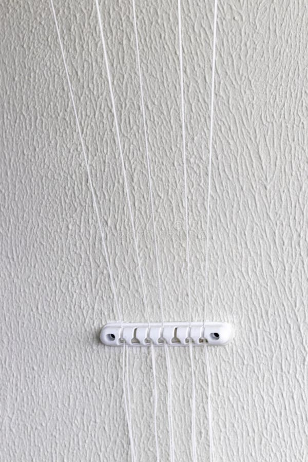 String from the Cloth Dryer Fixture on the Wall. Household Stock Image ...
