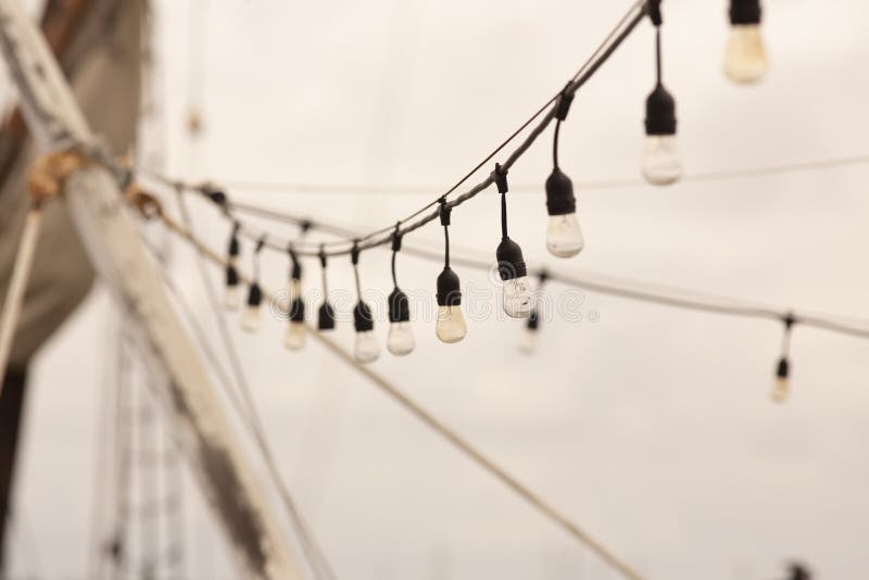 String of Festive Lights on Mast of Ship Stock Image - Image of ...