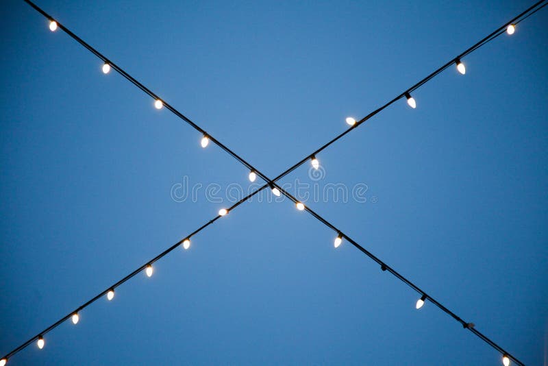 A String of Hanging White Lights Crossing Stock Image - Image of white ...