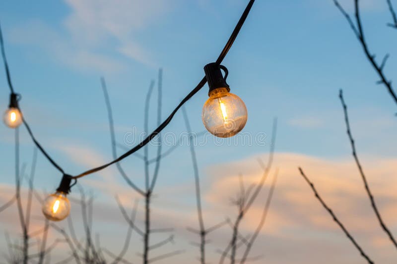 String Lights Against Sunset Sky Stock Photo - Image of decoration ...