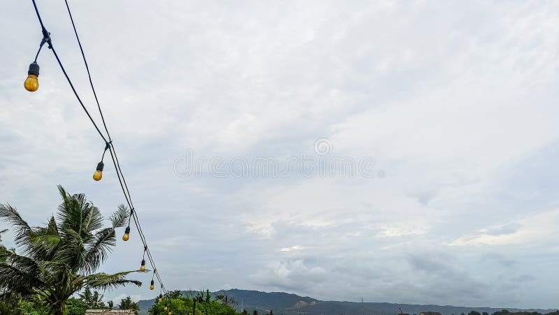 A String of Lights Hanging from a Power Line Stock Photo - Image of ...