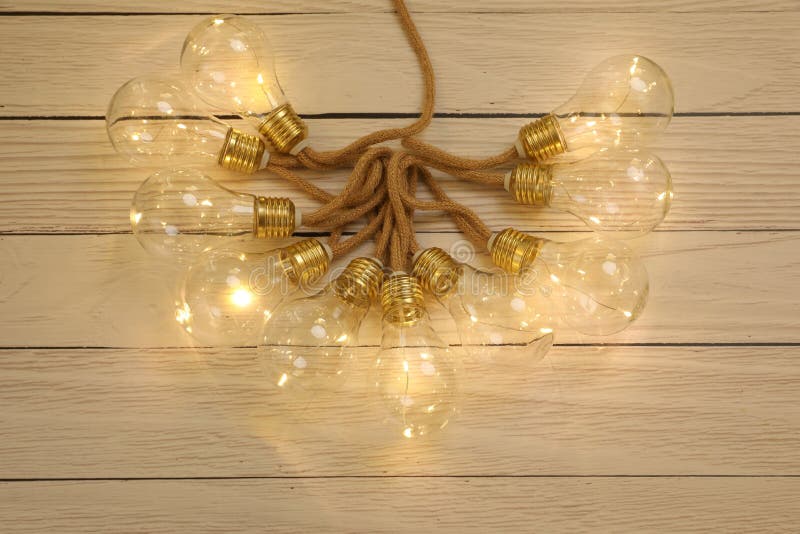 String Lights with Lamp Bulbs on Wooden Background, Top View Stock ...