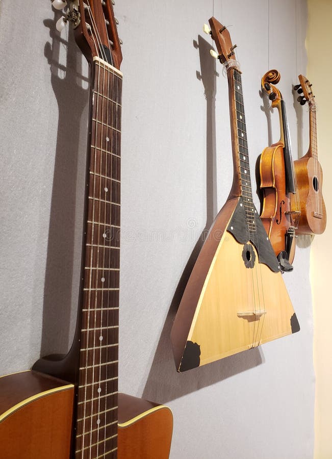 String Musical Instruments on a Wall Stock Photo - Image of instruments ...