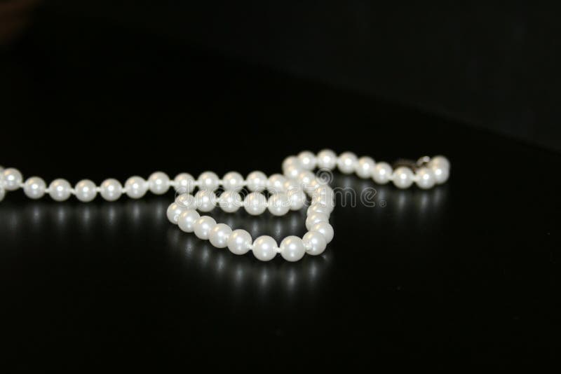 Strand Of Pearls On Black Background