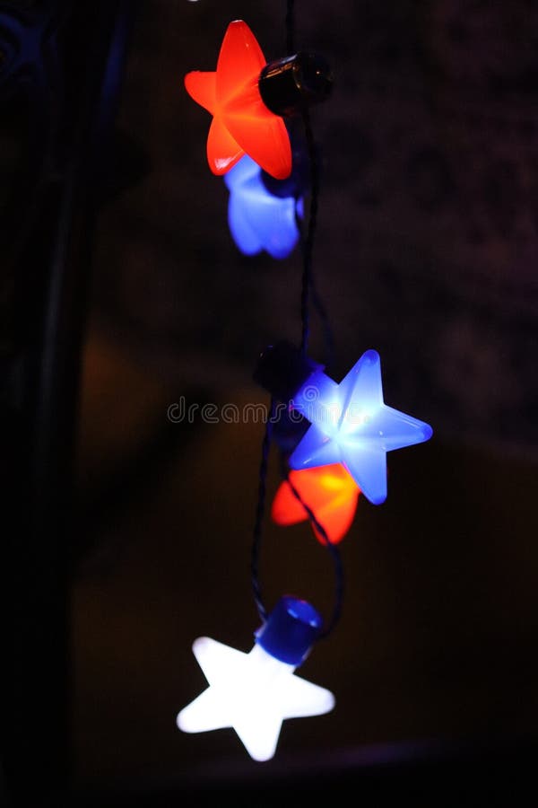 String of Red, White, and Blue Star Lights at Night Stock Image - Image ...