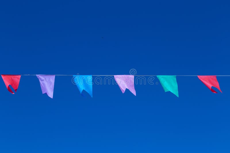 A String with Several Colorful Flags Hanging Stock Image - Image of ...
