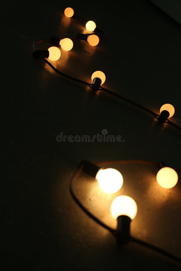 String Of Shining Light Bulbs Stock Photo - Image of bright, black ...