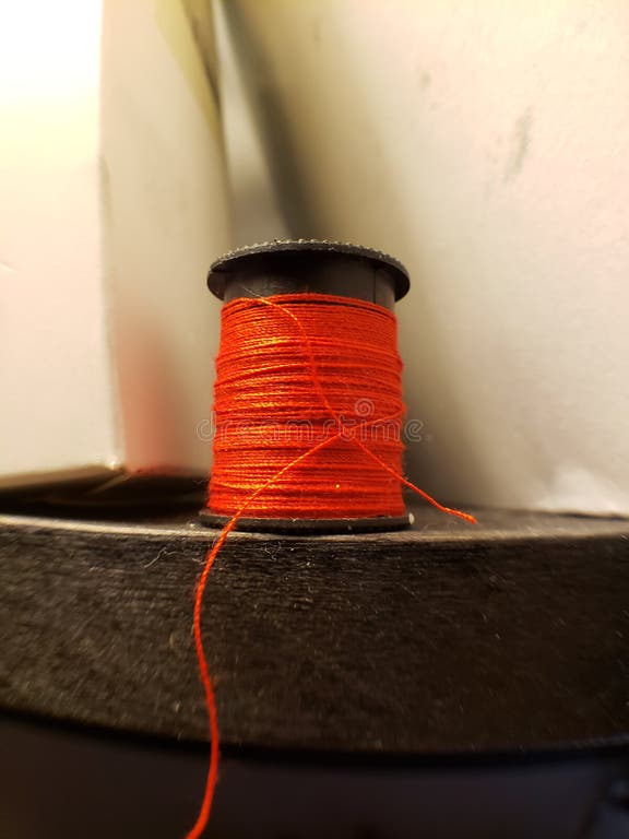 String Sitting on a Shelf Hanging Over the Edge Stock Image - Image of ...