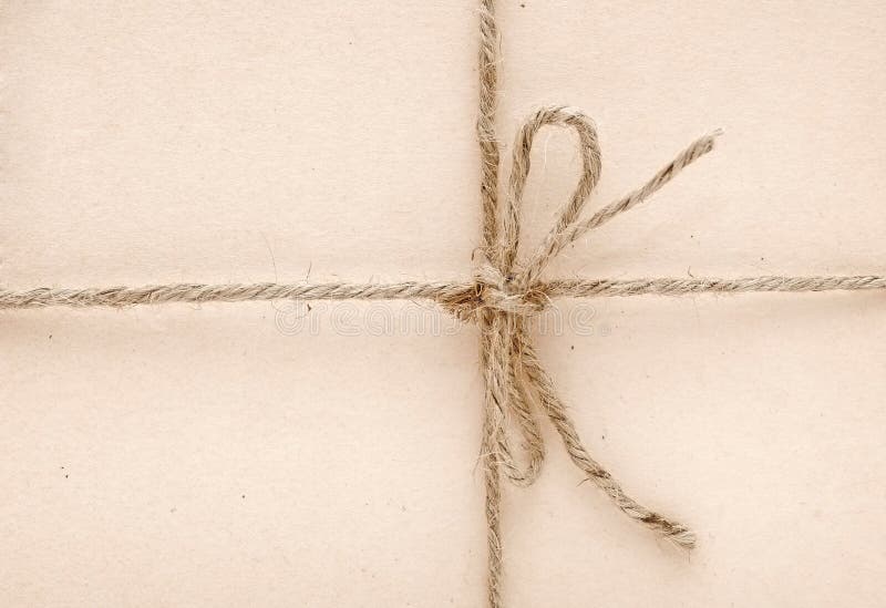 A Shipping Box Ties with String with a Blank Label Stock Image - Image ...