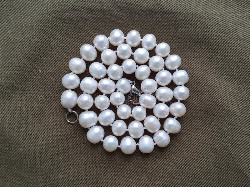 Twisted String of White Pearls Stock Photo - Image of fabric, pearls ...