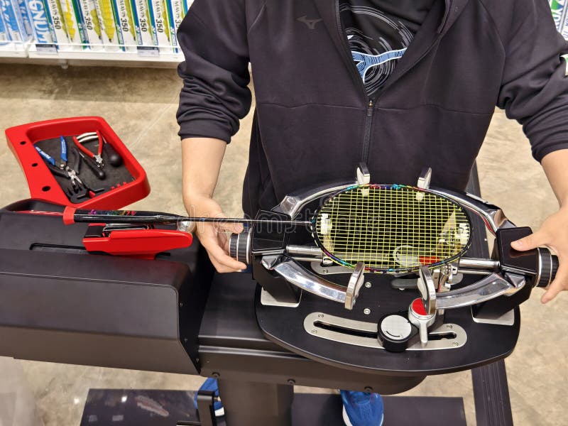 Strings a Badminton Racket on a Racket Stringing Machine. Stock Photo ... Strings a Badminton Racket on a Racket Stringing Machine. Stock Photo ...