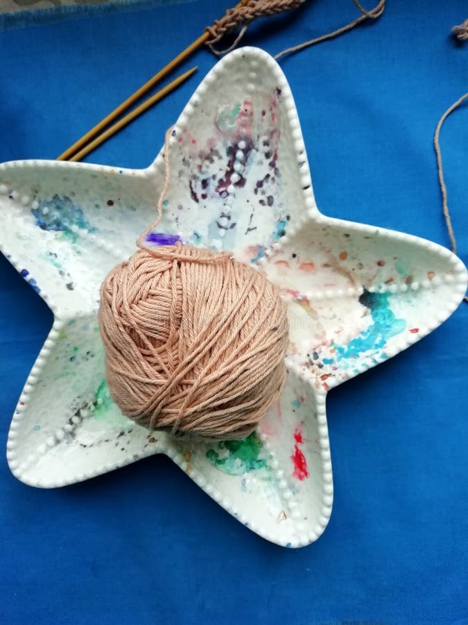 Strings in the Ceramic Star Plate on the Blue Fabric Stock Image ...