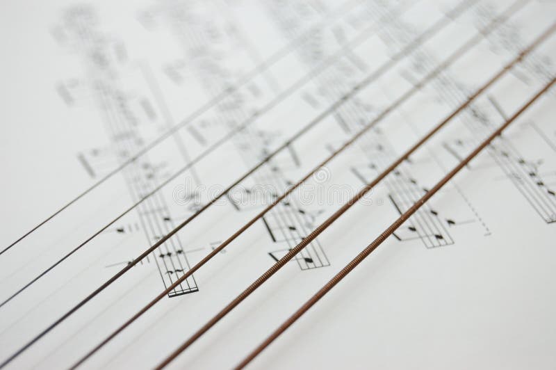 Strings of Musician Instrument Under Notes Stock Image - Image of ...