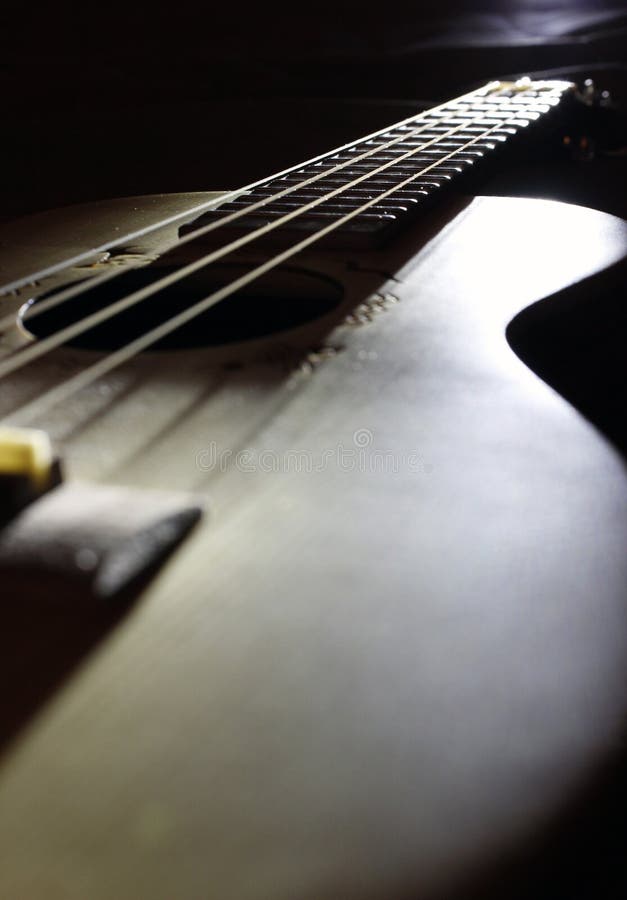 The Strings of a Six-string Guitar Shine in the Dark Stock Image ...