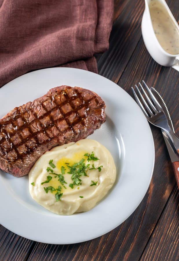 Strip Steak with Celery Puree Stock Photo - Image of mignon, potato ...