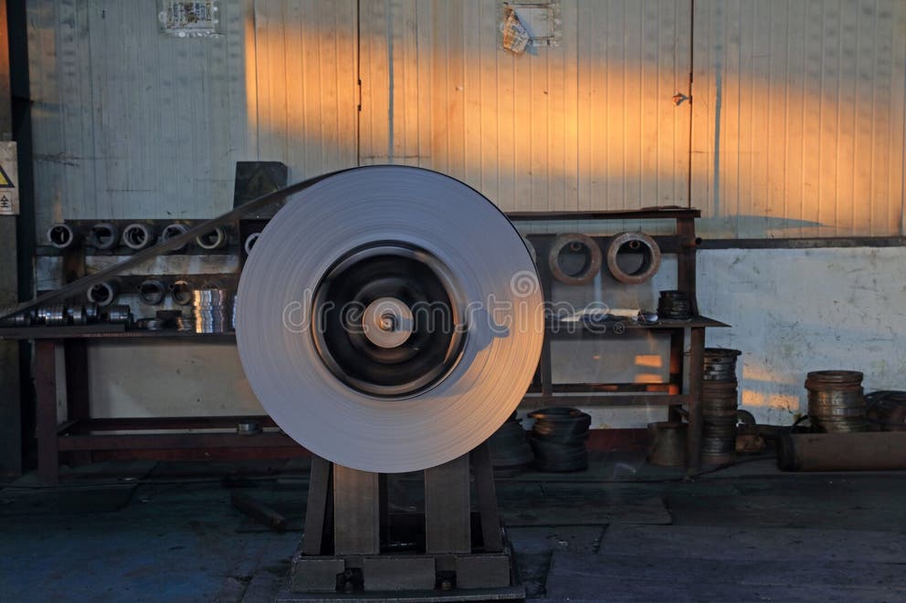 Strip steel in rotation stock photo. Image of production - 365707066