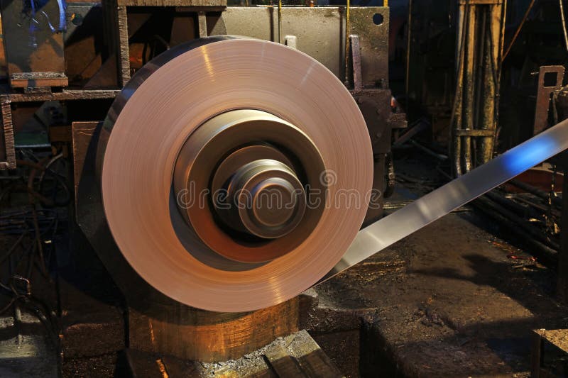 Strip steel in rotation stock photo. Image of installation - 384328350