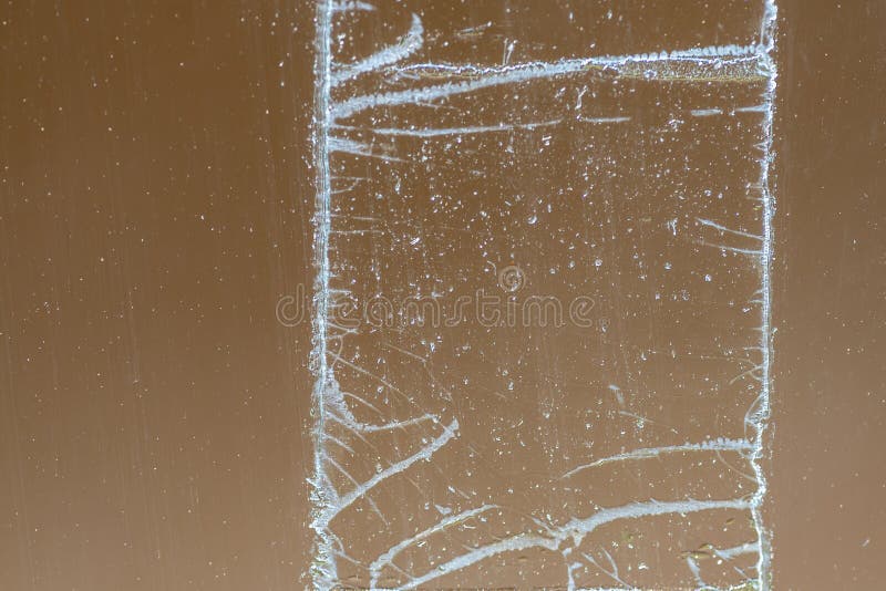 Strip of Tape Adhesive on a Glass Surface after Being Pulled. Stock ...