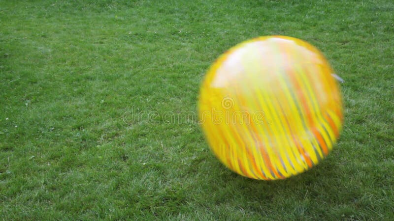 Striped Big Ball Fast Rolling Across the Stock Footage - Video of ...
