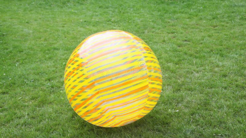 Striped Big Ball Rolling Across the Stock Video - Video of color ...