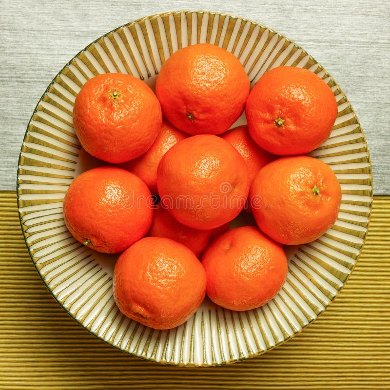 Striped Bowl of Oranges stock image. Image of texture - 93516599