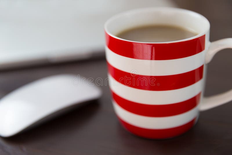 Striped Coffee Mug and Computer on Office Desk Stock Photo - Image of ...