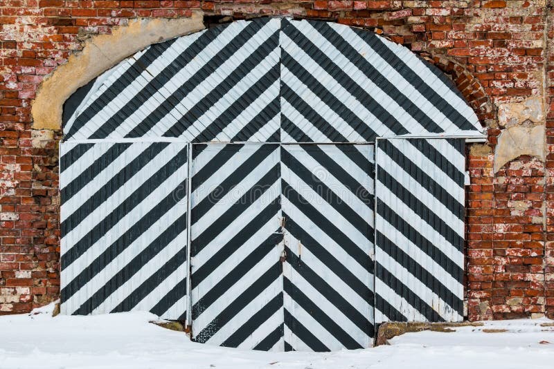 Striped Gate on Brick Facade Stock Image - Image of exterior, kronstadt ...