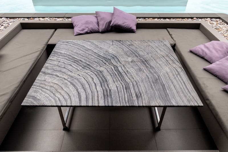 Striped Granite Dining Table with Pillow on Sofa at Side Swimming Pool ...