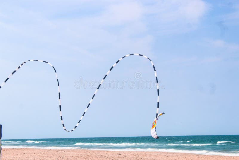 Striped Line for Kite Surfing Creates Curve Patterns Against a Cloudy ...