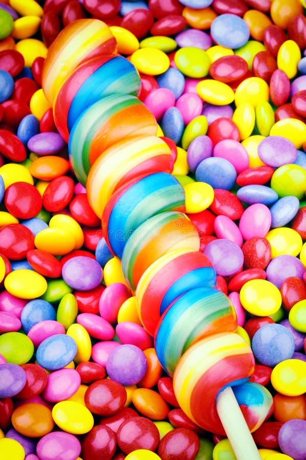 Striped Lollipop and Smarties Stock Photo - Image of blue, hard: 37146118