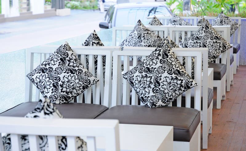 Striped pillow and table stock image. Image of land, chair - 23507473