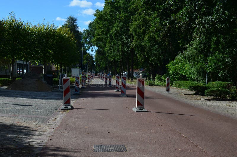 Striped Road Warning Posts on City Street Stock Photo - Image of danger ...
