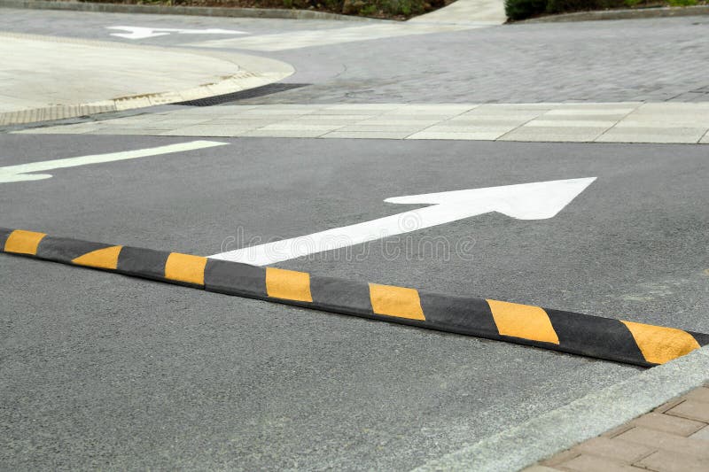 Striped Speed Bump on Street. Road Safety Stock Image - Image of road ...