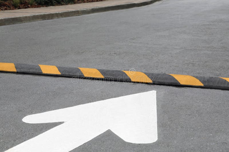 Striped Speed Bump on Street. Road Safety Stock Image - Image of road ...
