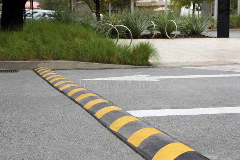 Striped Speed Bump on Street. Road Safety Stock Image - Image of road ...