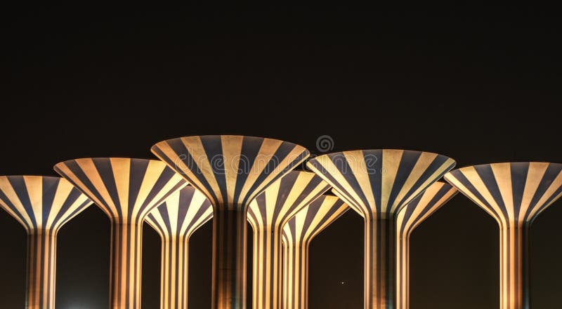 Striped Water Towers at Night Stock Photo - Image of brown, striped ...