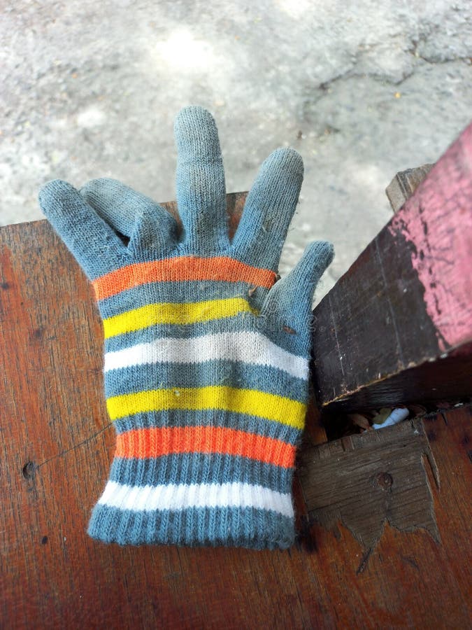 Striped Woolen Gloves on the Table Stock Photo - Image of blue, brown ...