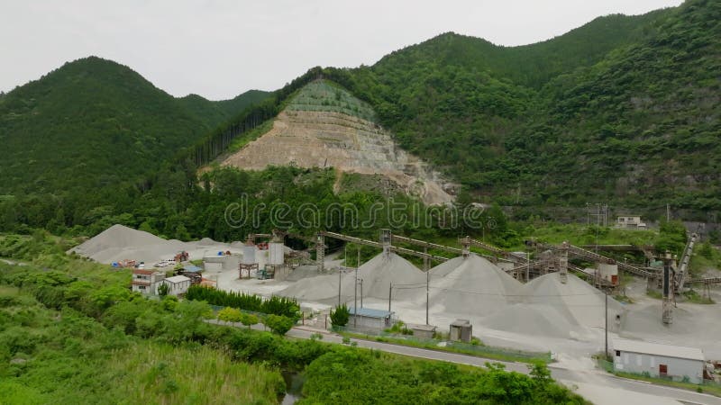 Stripped Forest on Mountain with Sediment Piles and Mining Equipment ...